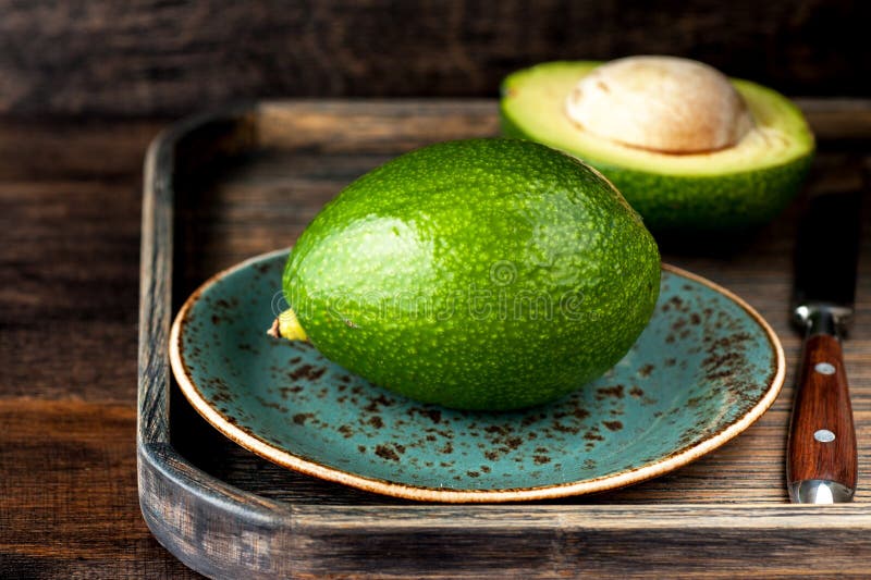 Avocado on a Wooden Tray Vintage Stock Photo - Image of tropical, ripe ...