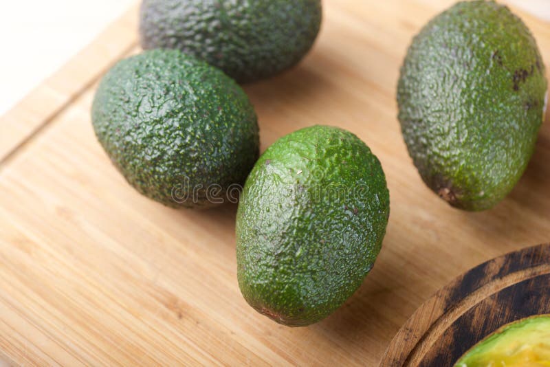 Avocados on cutting board stock image. Image of food - 81219851