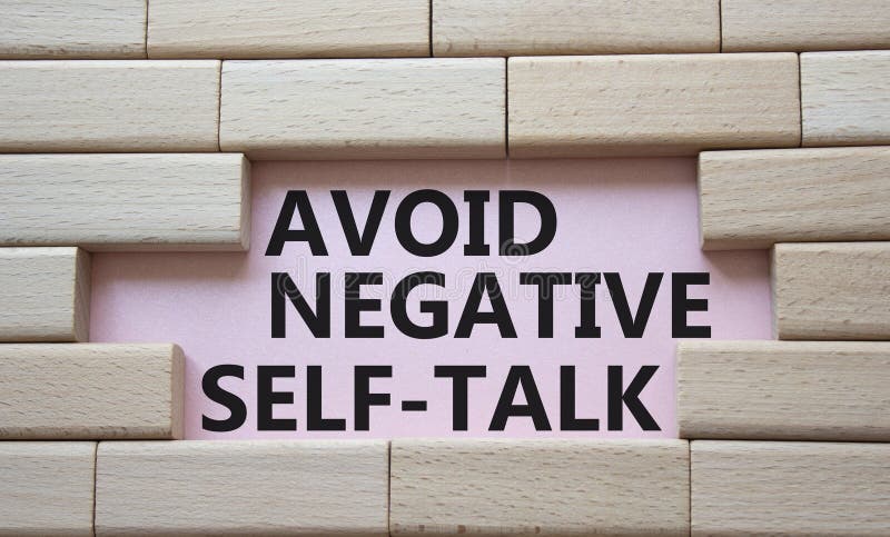Avoid Negative Self-talk Written on Wooden Blocks Standing on an Open ...