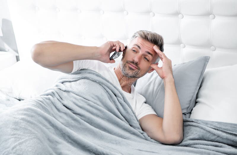 Awaken Mature Man in Bed Speaking on Phone Stock Image - Image of ...