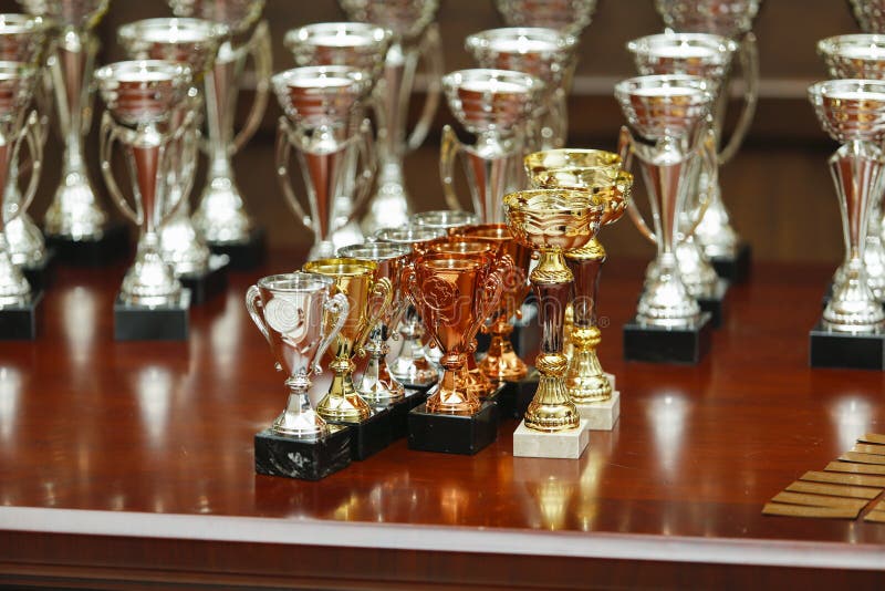 Kids and Adult Race Awards on a Table Stock Image - Image of levels ...