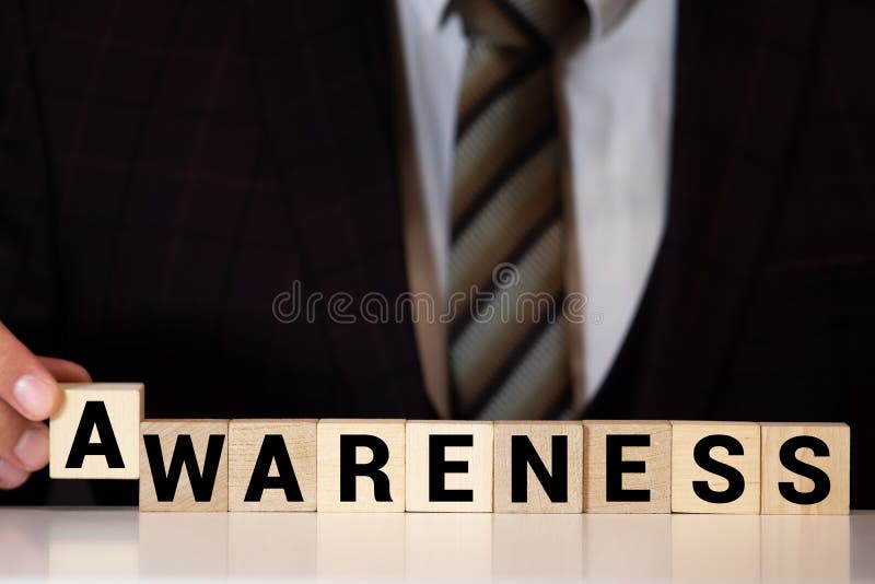 Awareness Word Written on a Wooden Block, Near a Cactus Flower Stock ...