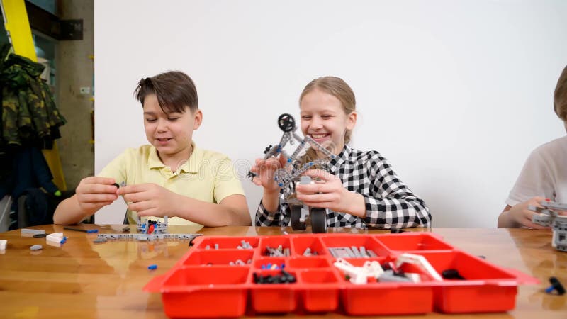 Young Friends Having Fun, Using Building Kit. Stock Video - Video of ...