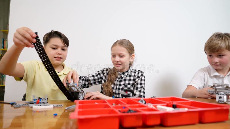 Young Friends Having Fun, Using Building Kit. Stock Video - Video of ...