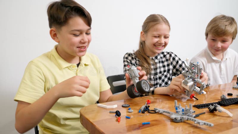 Young Friends Having Fun, Using Building Kit. Stock Video - Video of ...