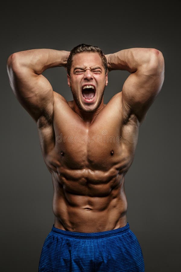 Awesome Muscular Guy on Grey Background Stock Photo - Image of anger ...