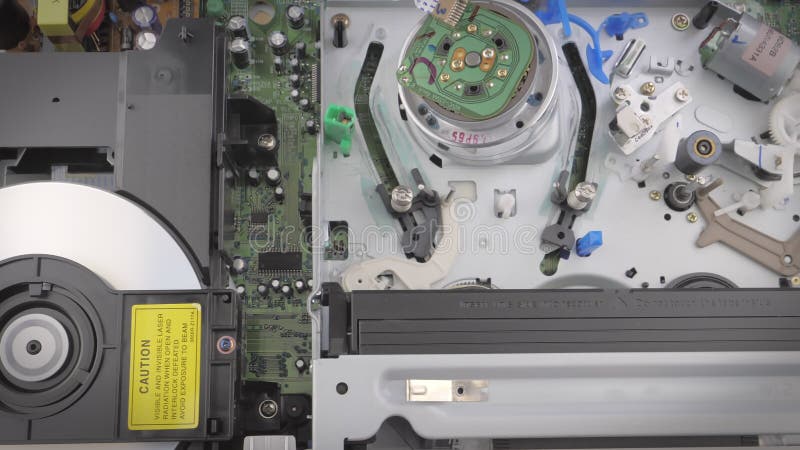 Awesome Shot of a Vhs Cassette and a Dvd Being Inserted into a Player ...