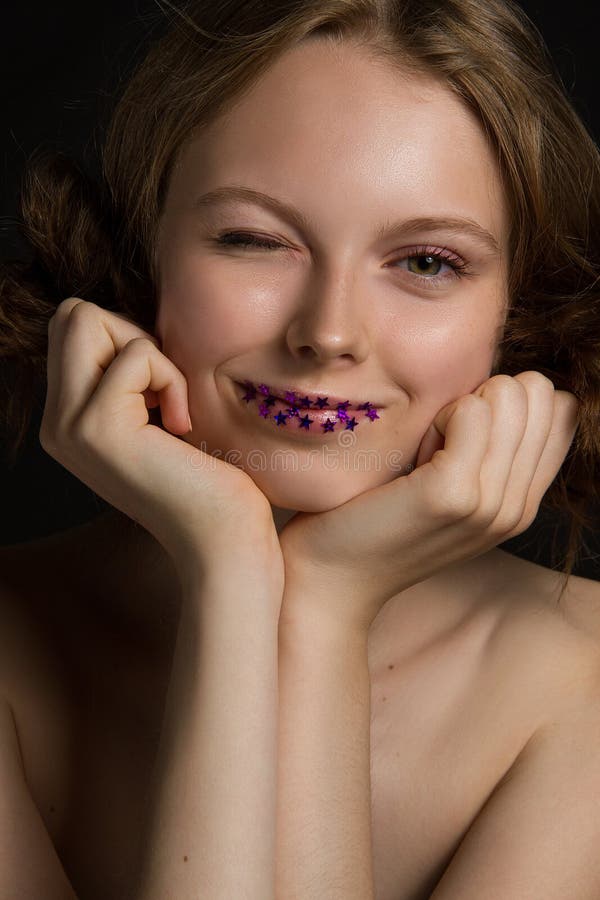 Awesome Young Model Smiles and Winks Stock Image - Image of violet ...