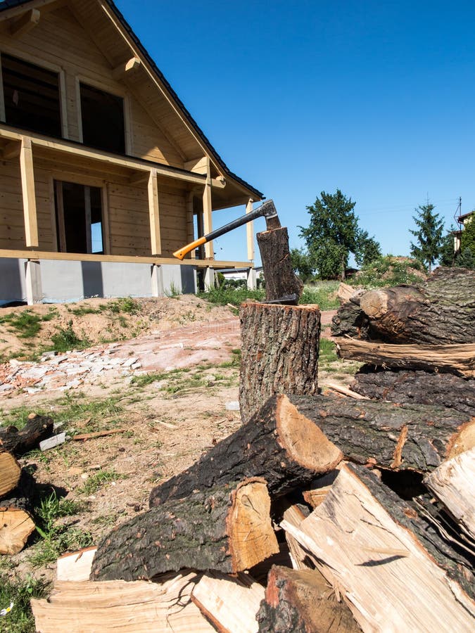Ax stuck in a log standing stock photo. Image of heating - 56235624