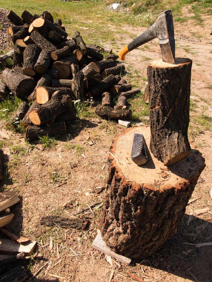 Ax stuck in a log standing stock image. Image of blade - 56237617