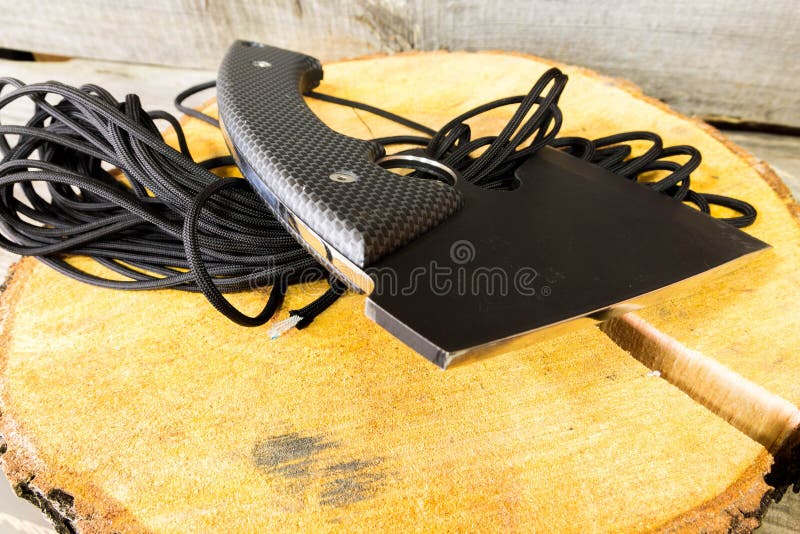 Axe Tourist on a Wooden Background and Parakordom. Rear View. Stock ...