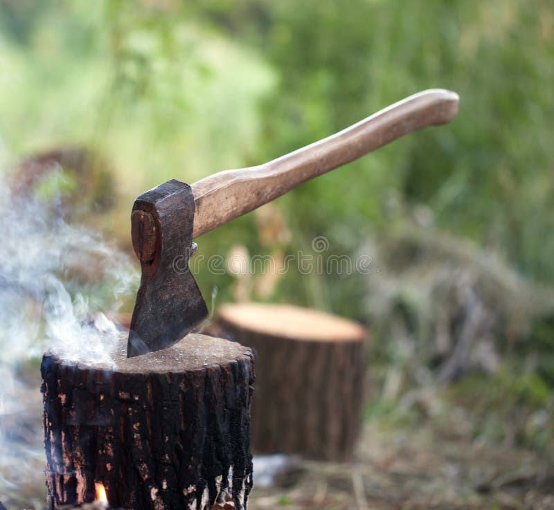 Axe in Tree Stump and Campfire with Smoke in Summer Forest Stock Photo ...