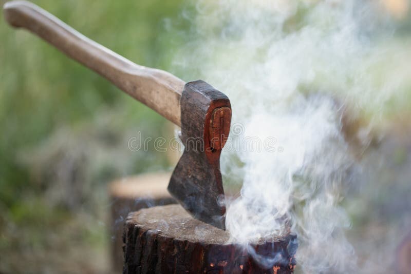 Axe in Tree Stump and Smoke from Fire Stock Image - Image of felling ...