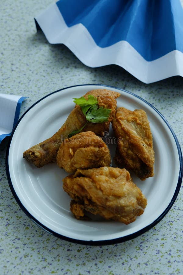 Ayam Goreng Crispy or Crispy Fried Chicken on White Plate Stock Image ...
