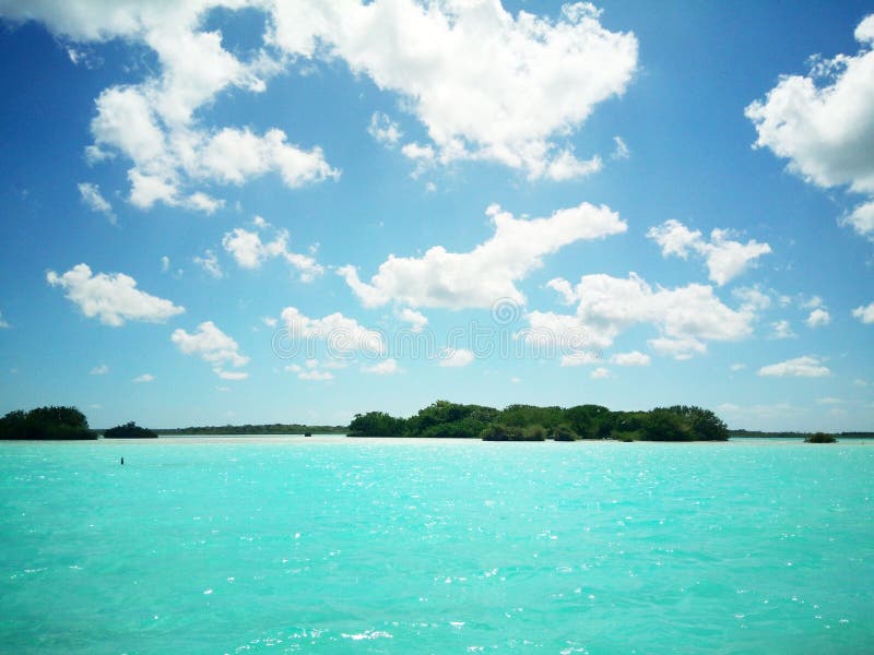 Azure Lake Surrounded by Green Trees on a Sunny Morning Stock Image ...