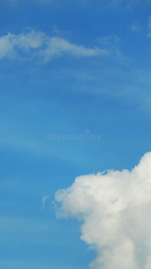Azure Sky or Sky Blue Beautiful White Spring Clouds. Blue Sky Background with Clouds. Vertical ...