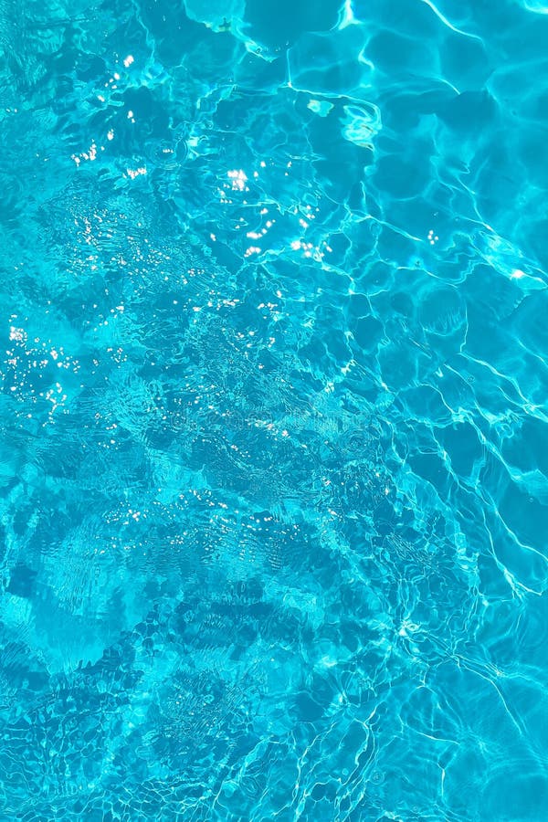 Azure Transparent Texture of Water in a Blue Pool with Splashes from ...