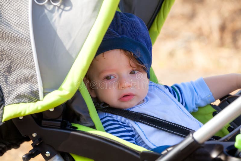Babby boy in stroller stock image. Image of happiness - 46089749