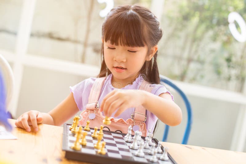 Babies Girl Playing Chess on Wood Table. Stock Image - Image of learn ...