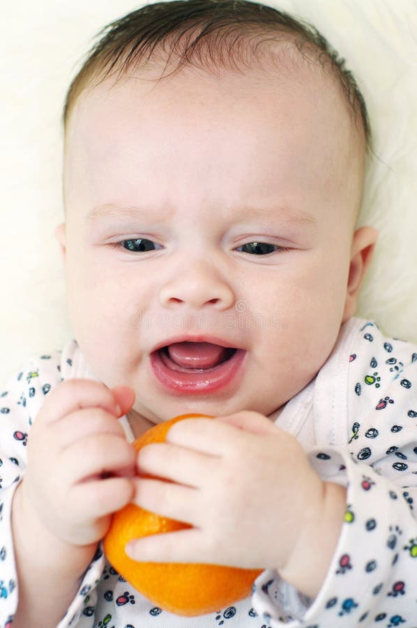 Baby Age of 3 Months with Tangerine Stock Photo - Image of lick ...