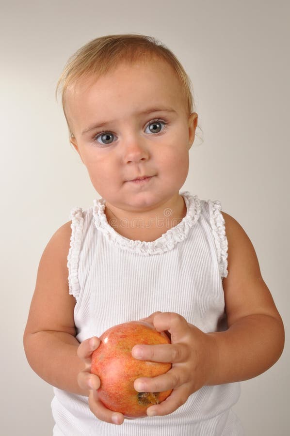 Baby with an apple stock photo. Image of cute, babyhood - 22382838
