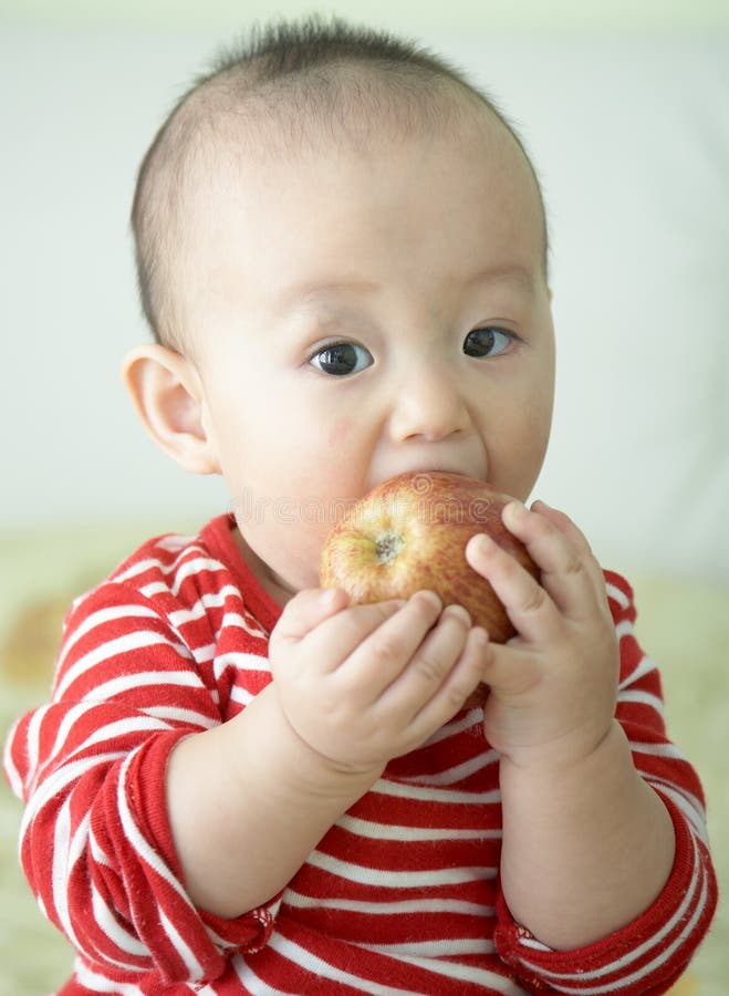 Baby and apple stock image. Image of face, hold, infant - 8377583