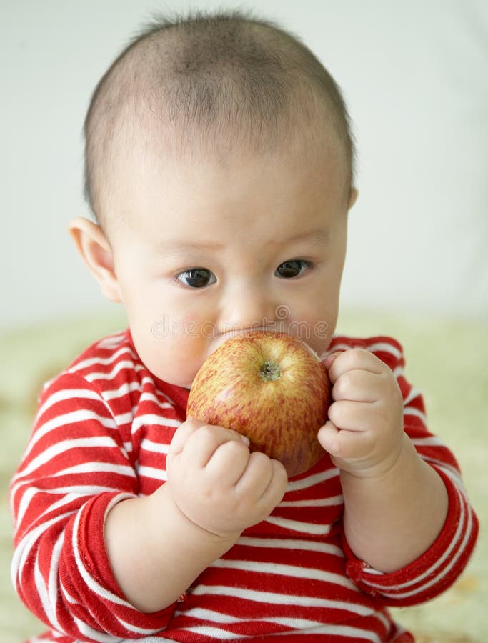 Baby and apple stock photo. Image of innocent, asian, face - 8377622