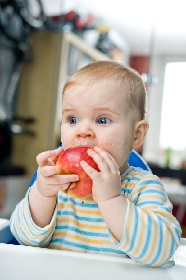 Baby with an Apple at Home; Vertical Stock Image - Image of cheerful ...