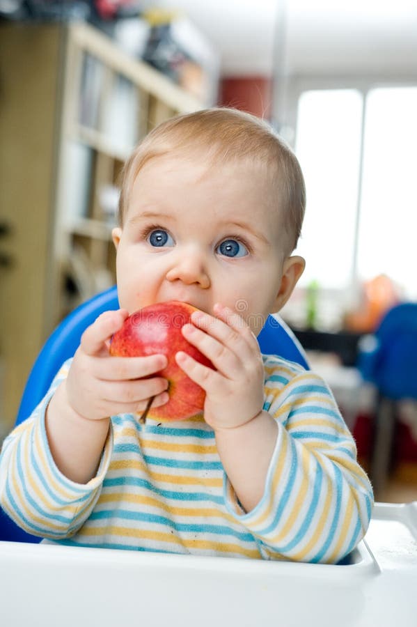 Baby with an Apple at Home; Vertical Stock Photo - Image of nice ...