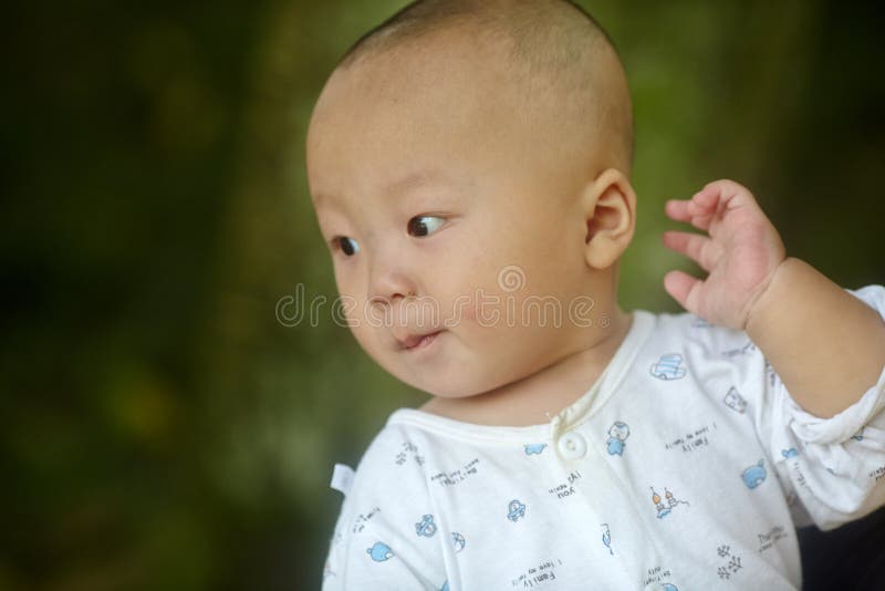 Baby in arm stock photo. Image of mood, young, intelligent - 44047950