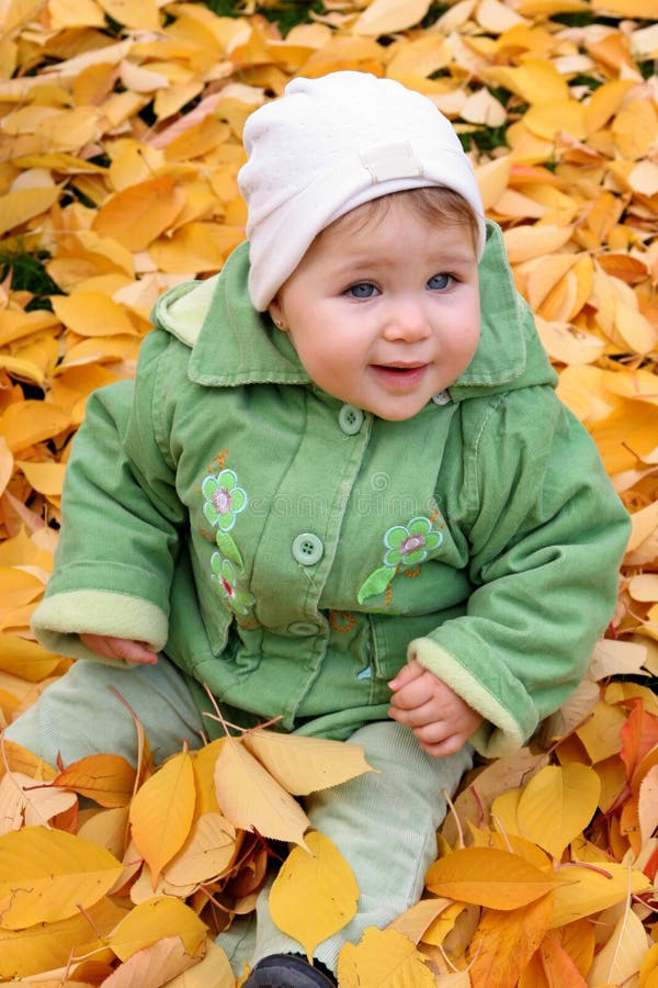 Baby in autumn leaves stock photo. Image of parent, adorable - 3539248