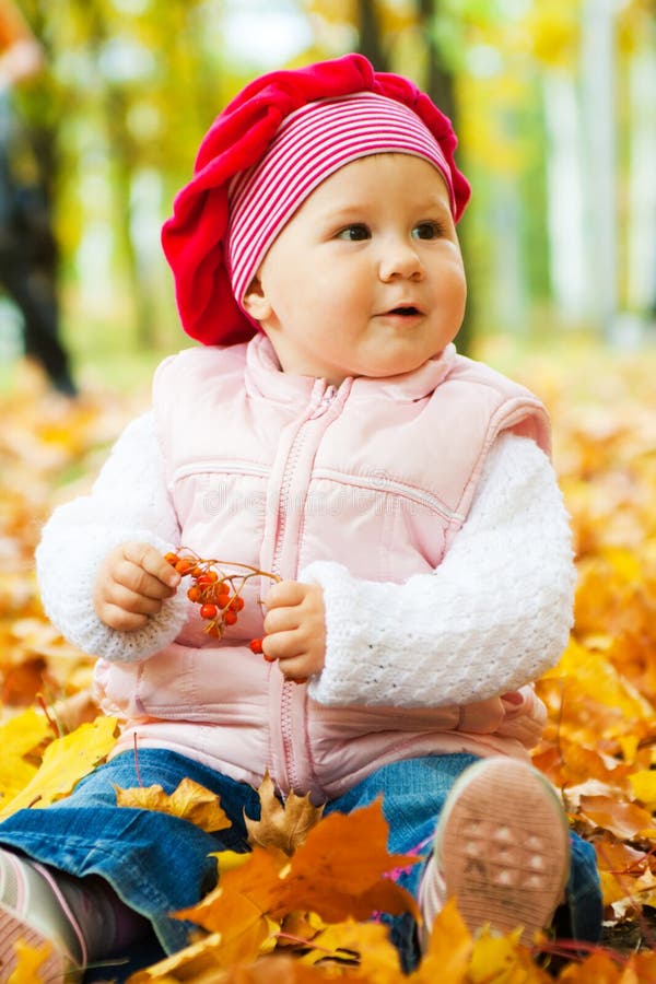 Baby in autumn leaves stock photo. Image of beautiful - 9166846