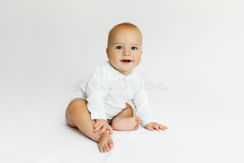 Baby is on the bad. stock image. Image of adorable, care - 161654975