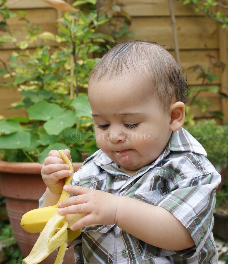 Baby and banana stock photo. Image of tucking, healthy - 9522006