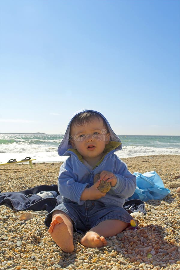Baby at the beach stock image. Image of children, sitting - 1107777