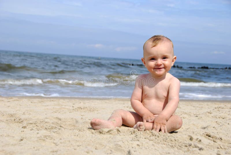 Baby on the beach stock image. Image of water, skin, play - 15645525