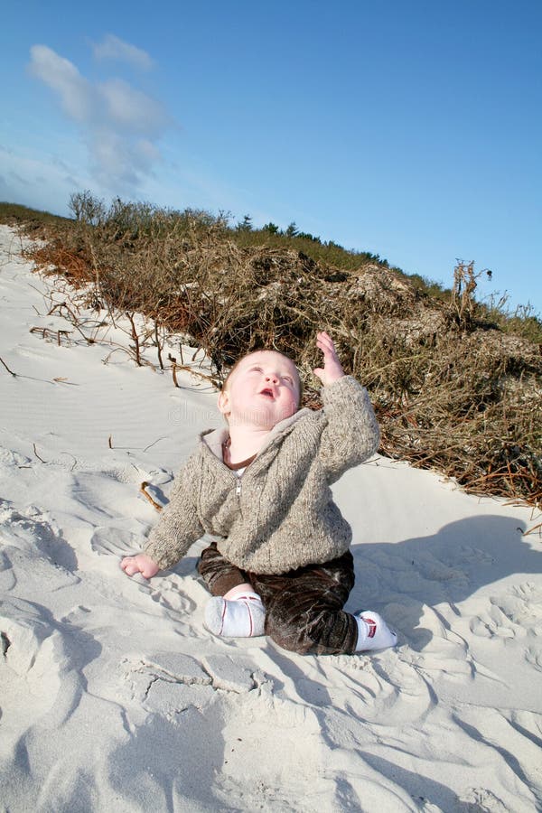 Baby on beach stock photo. Image of cute, life, look, hand - 1881726