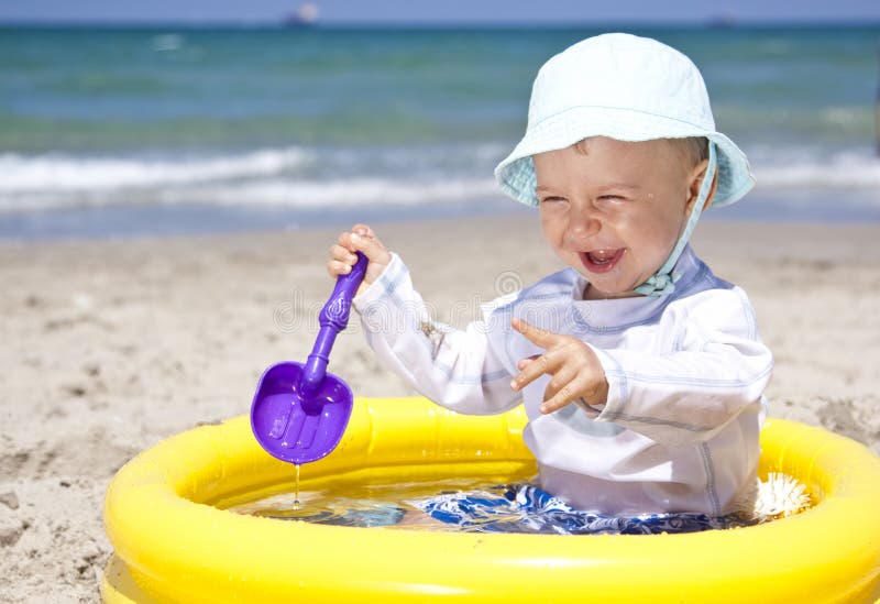 Baby on the beach stock photo. Image of playful, activity - 19752236