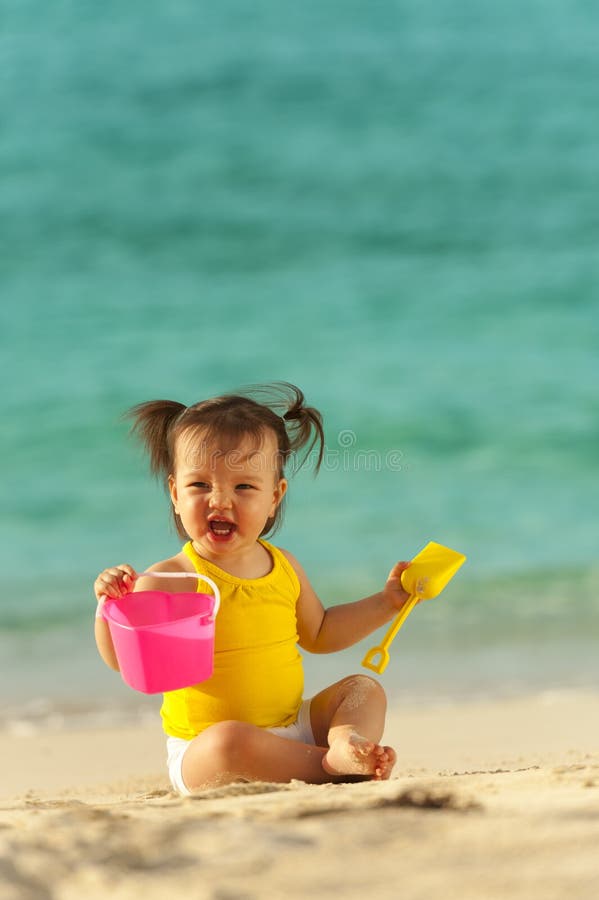 Baby at the beach stock photo. Image of copyspace, sand - 24236312