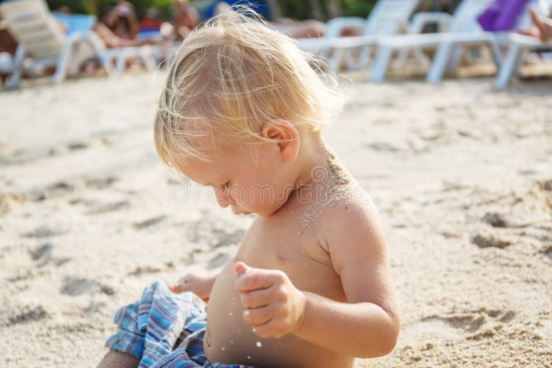 Baby on a beach stock photo. Image of beach, portrait - 65995126