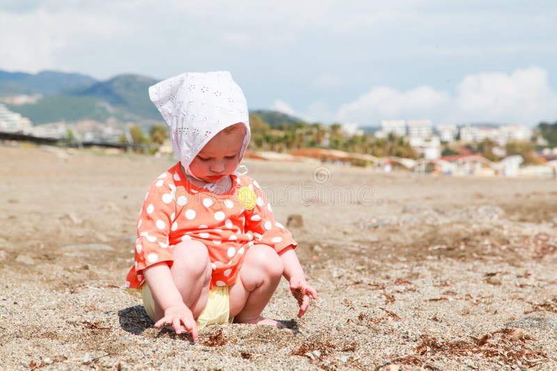 Baby on the beach stock photo. Image of outdoor, blue - 55218568