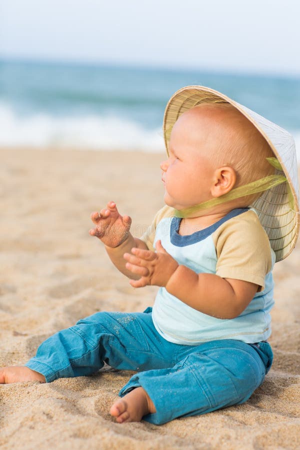 Baby on the beach stock image. Image of nature, conceptual - 34699911