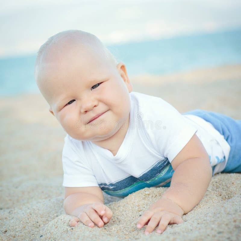Baby on the beach stock image. Image of nature, conceptual - 34699911