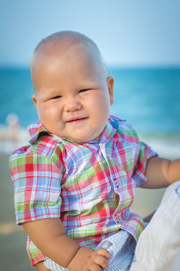 Baby on the beach stock image. Image of peaceful, beautiful - 34699921