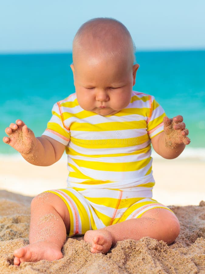 Baby on the beach stock photo. Image of cute, sitting - 41333406