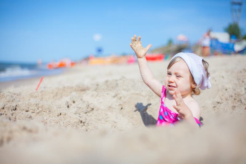 Baby on the beach stock image. Image of looking, babies - 32602885