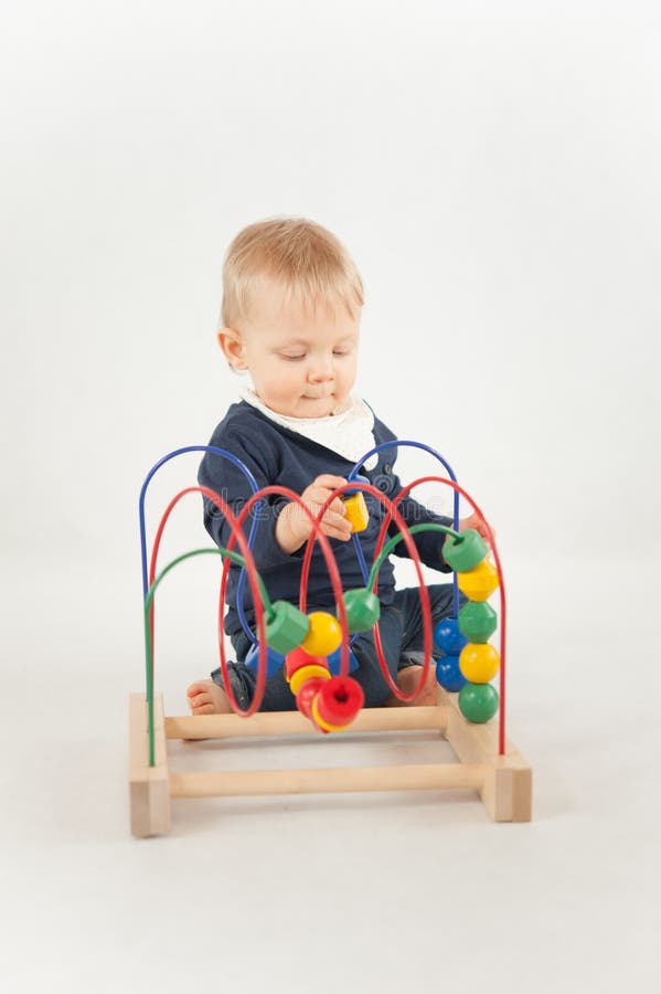 Baby with Bead Toy stock image. Image of girls, colors - 30938563