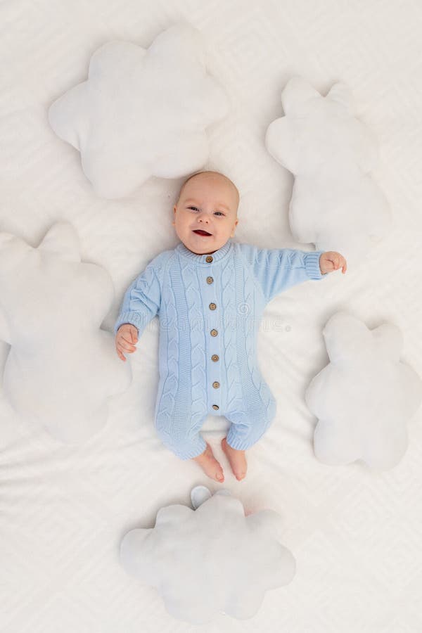 Baby on the Bed among the Cloud Pillows. Textiles and Bedding for ...