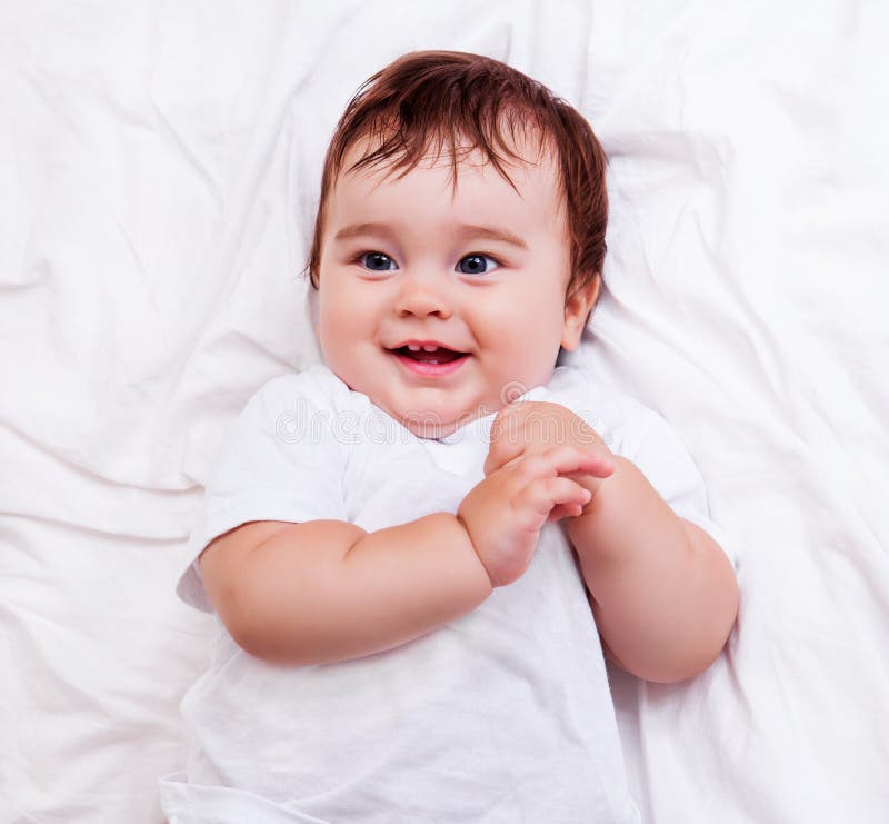 Baby in bed stock image. Image of parenthood, happiness - 33282367