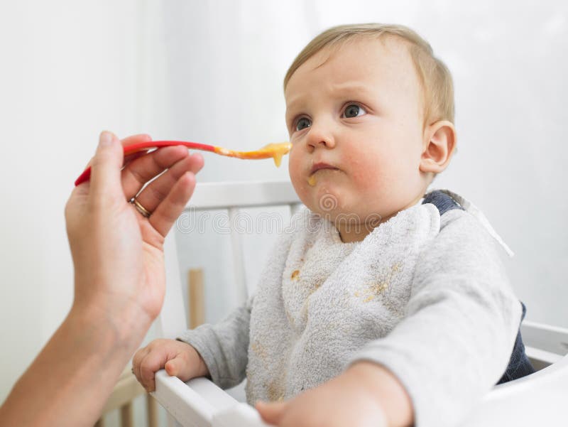 Baby Being Fed stock image. Image of cropped, indoors - 12021919
